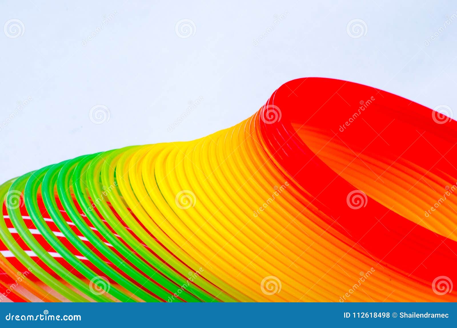 A Rainbow Slinky or Spring editorial stock photo. Image of yellow ...