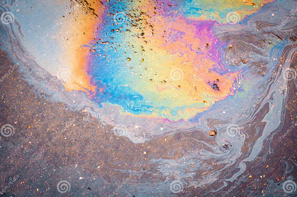 Rainbow Spots from Spilled Engine Oil in Puddle Stock Image - Image of ...