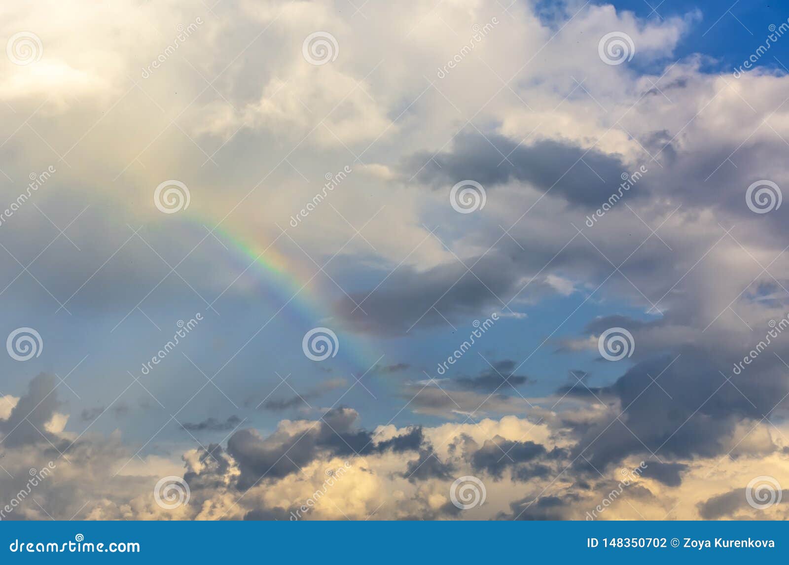Rainbow in the Spring Cloudy Sky after a Thunderstorm Stock Photo ...