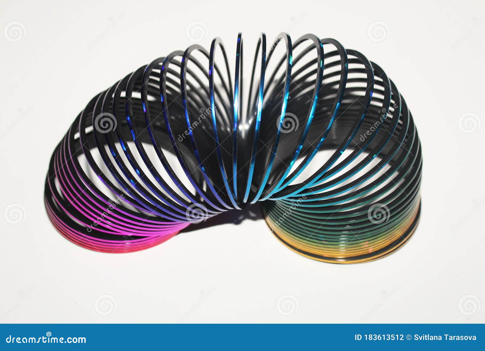 Rainbow Spring Toy Isolated on White Background. Editorial Photography ...