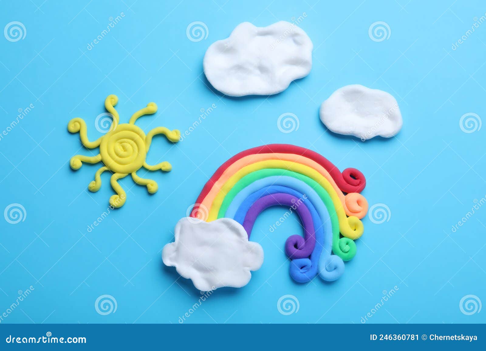 Rainbow, Sun and Clouds Made from Play Dough on Light Blue Background ...