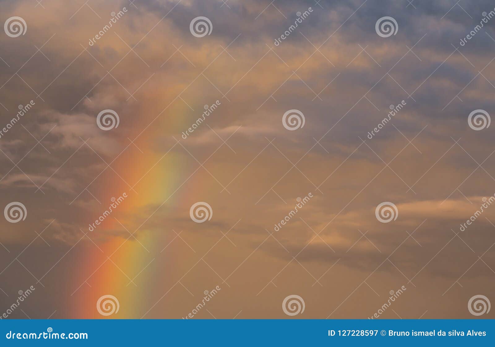 Rainbow at Sunset with a Cloudy Sky. Stock Image - Image of color ...