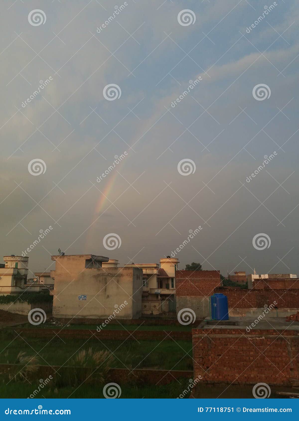 Rainbow editorial photo. Image of village, area, home - 77118751