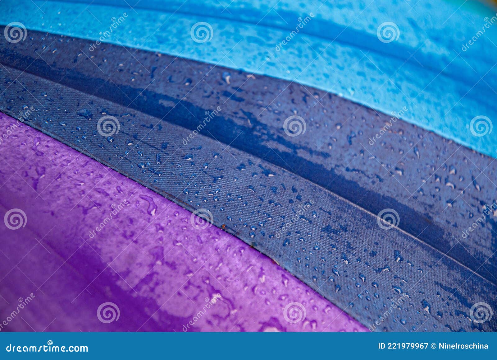 Raindrops On Blue Purple Shades Umbrella Closeup Wet Fabric Texture