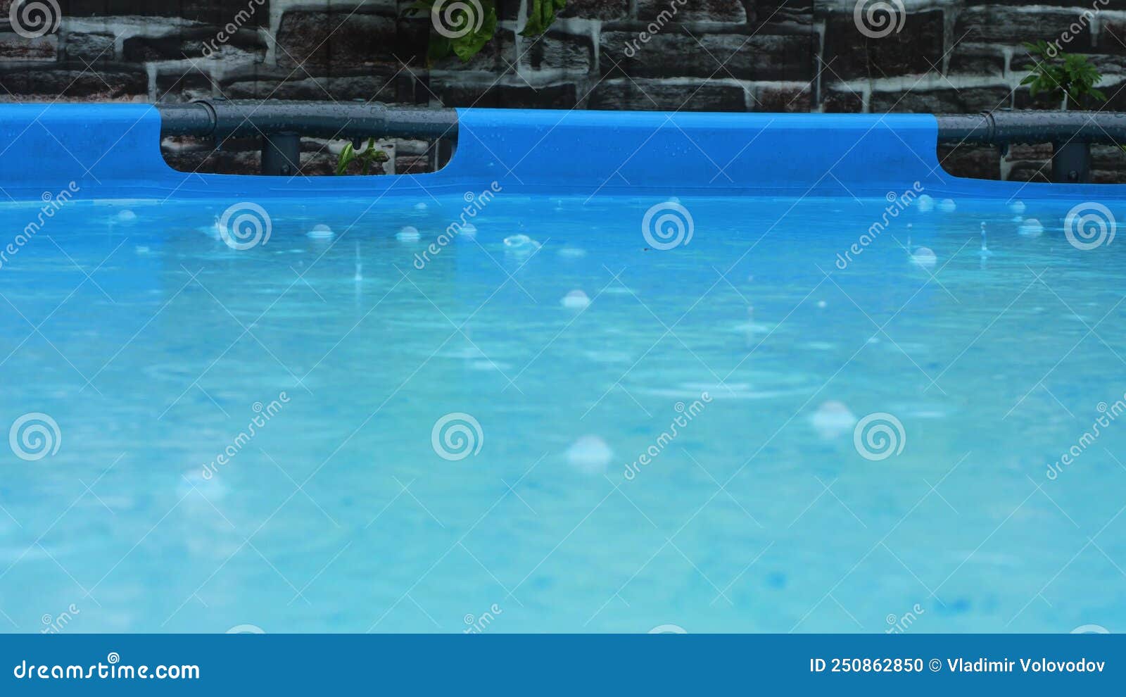 Raindrops and Bubbles on the Surface of the Water in a Blue Frame Pool ...