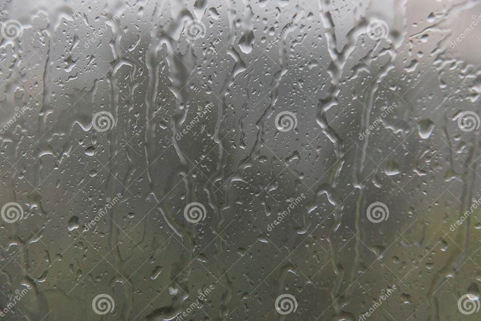 Raindrops Drip Down on the Window Glass. Soft Selective Focus Stock ...