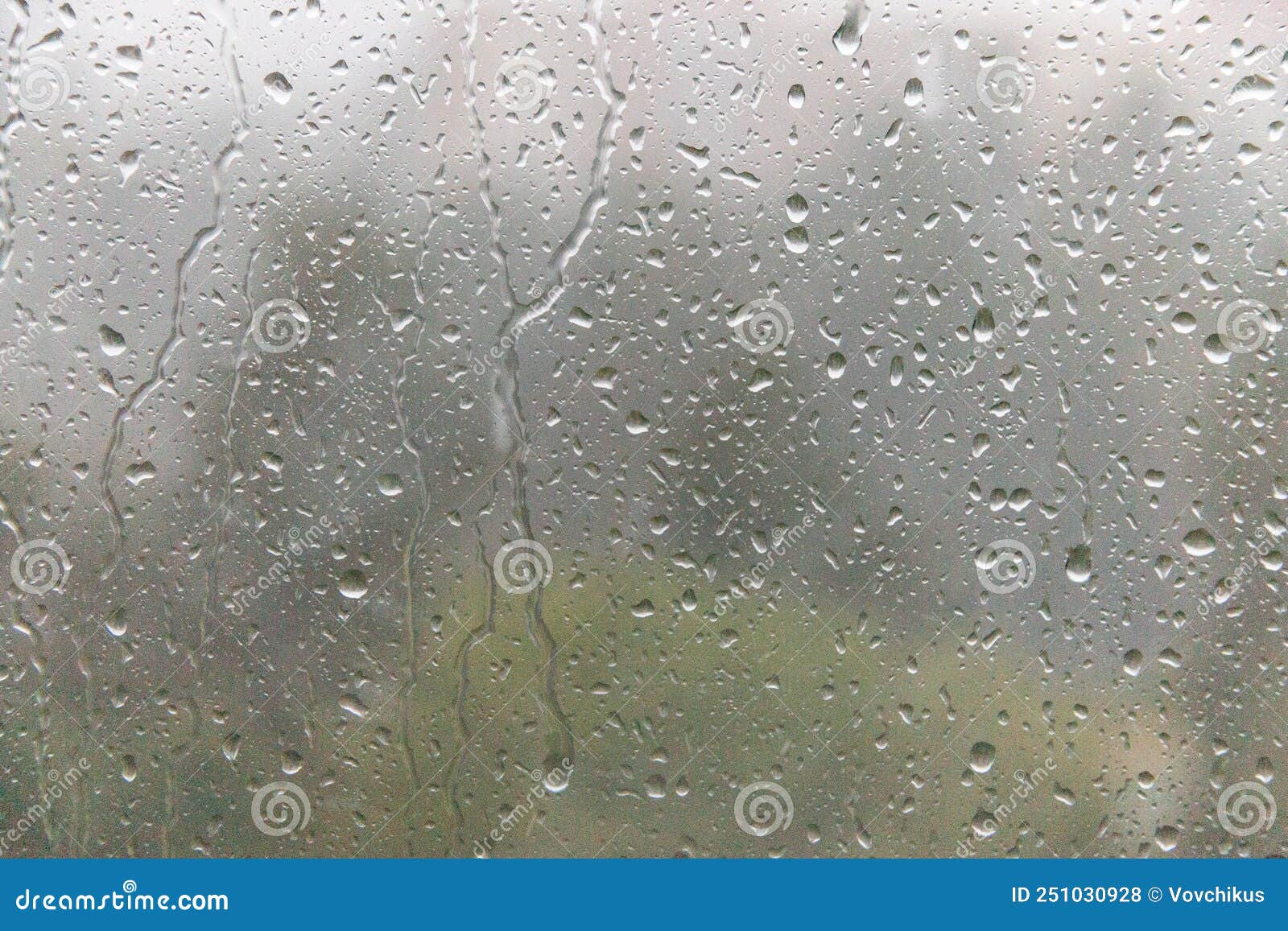 Raindrops Drip Down on the Window Glass. Soft Selective Focus Stock ...