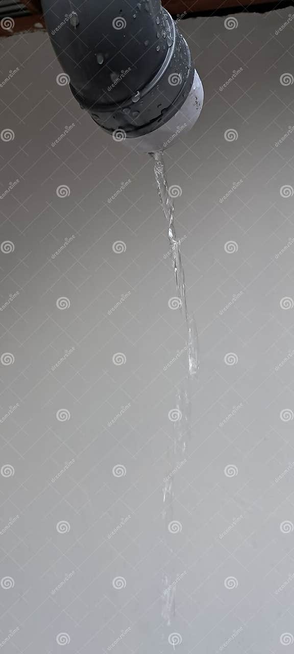 Raindrops Falling from the Pipe. Stock Photo - Image of rain, water ...