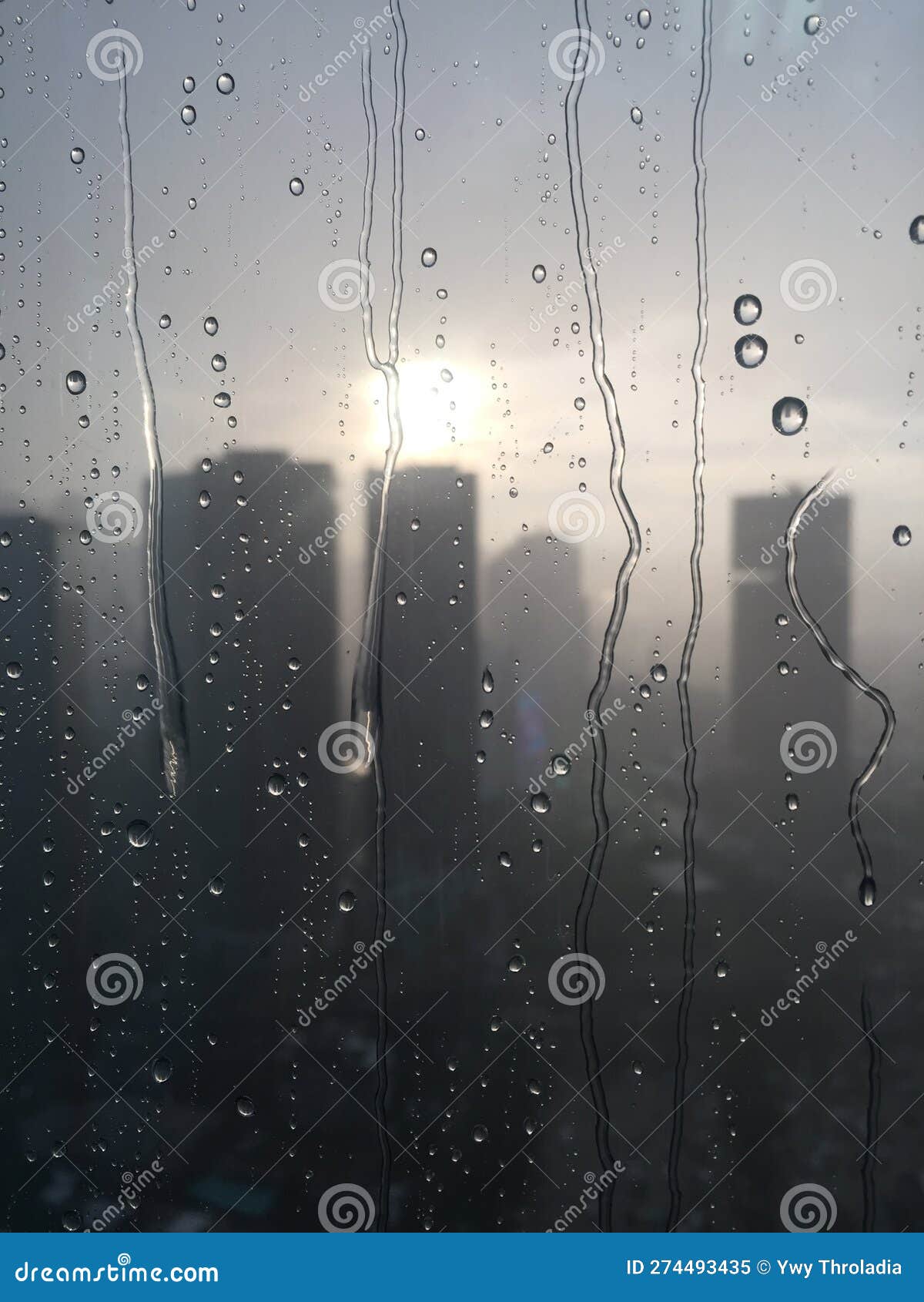 Raindrops Falling on the Window of a Tall Building during the Day Stock ...