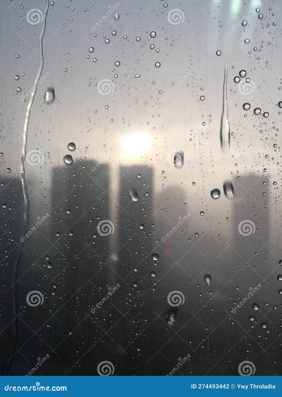 Raindrops Falling on the Window of a Tall Building during the Day Stock ...