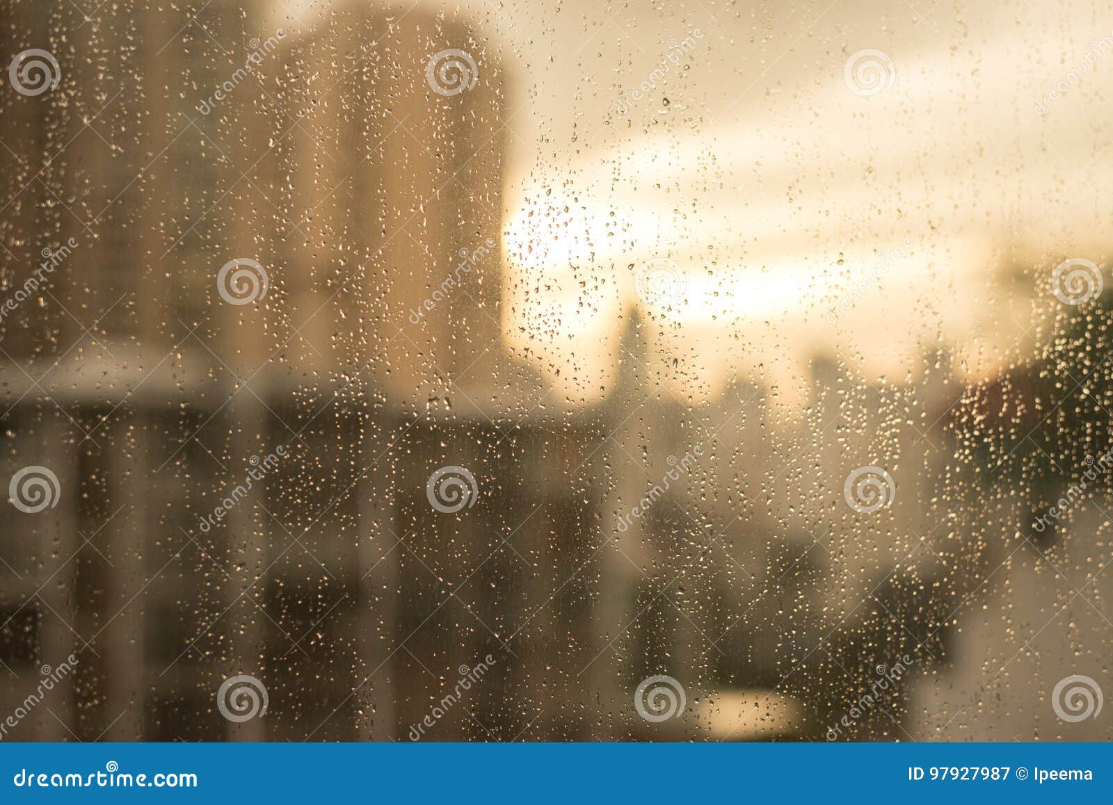 Raindrops on Glass Window. with Blur Buildings and Warm Tone Stock ...