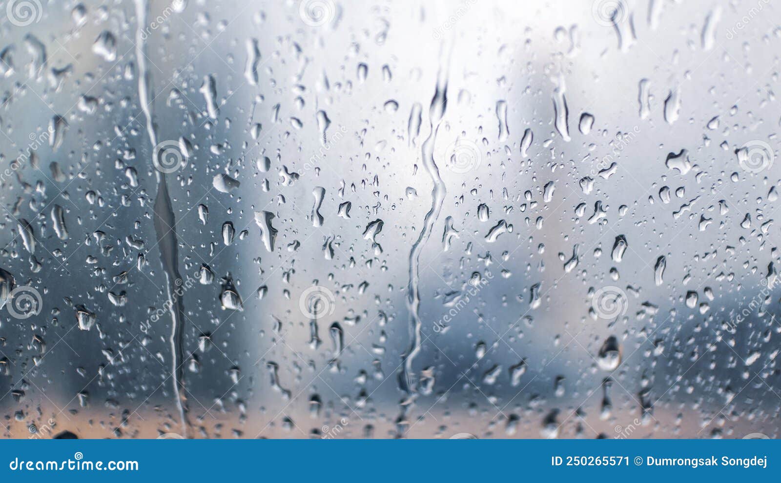 Raindrops Over the Window with Buildings of the City in the Background ...