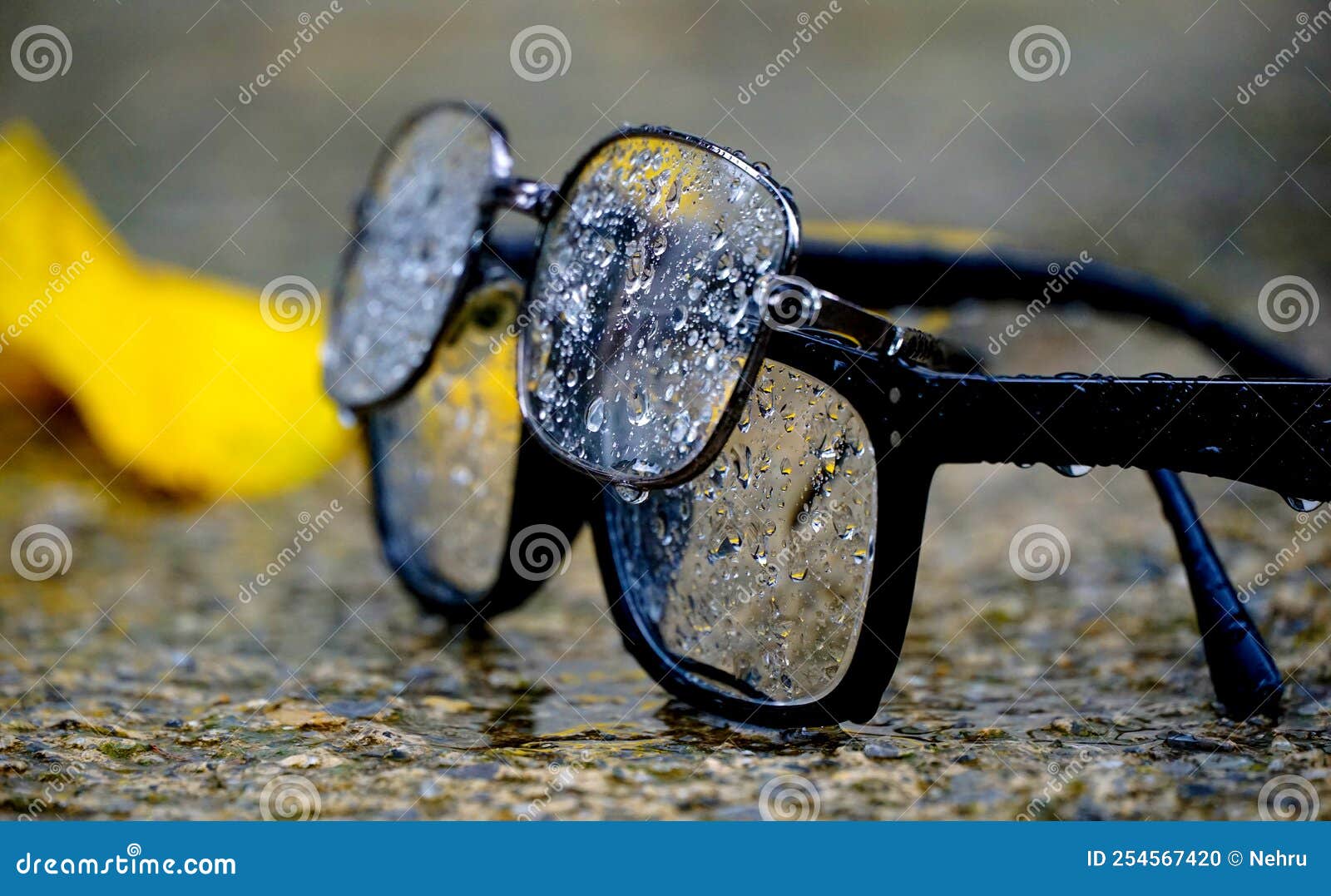 Raindrops on Reading Glasses Placed on a Concrete Background. Stock ...