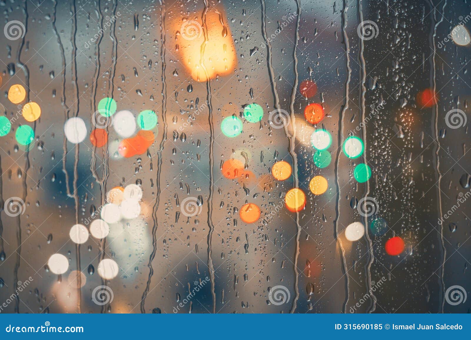 Raindrops on the Window and Multi Colored Street Lights at Night Stock ...