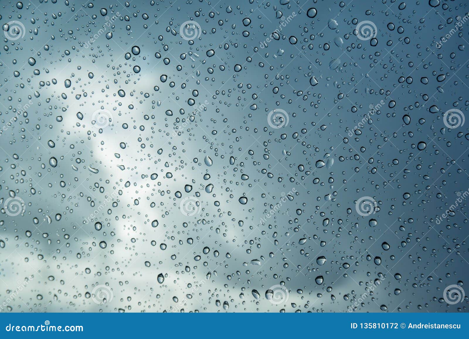 Raindrops on the Windshield; in the Background Dark Sky and a Break in ...