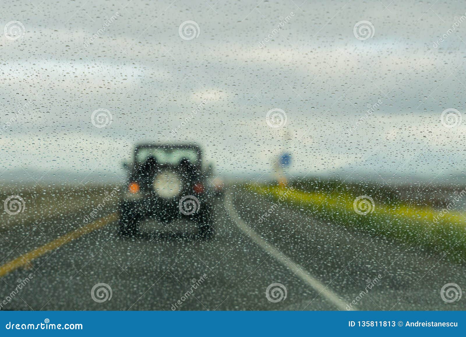 Raindrops on the Windshield while Driving on a Freeway on a Rainy Day ...