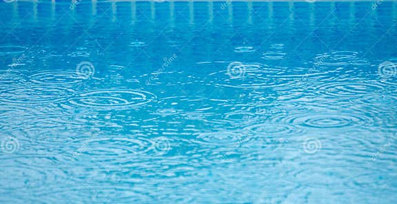 Raining on pool water stock photo. Image of graphic - 325090780