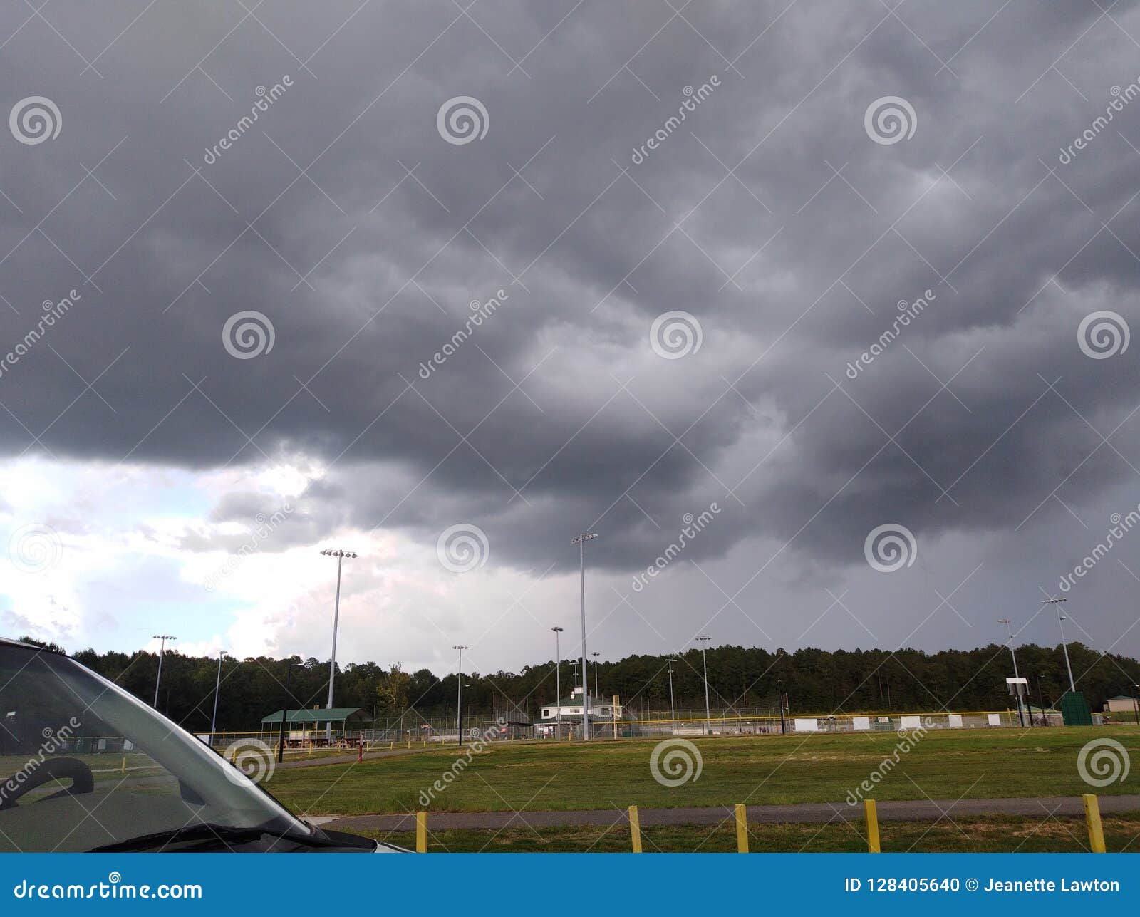Rainstorm Off in the Distance Over Baseball Field Stock Photo - Image ...