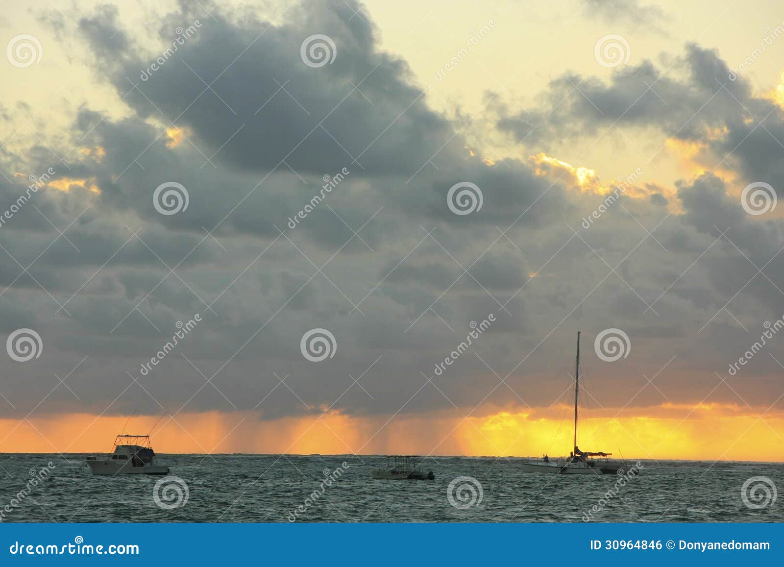 Rainstorm in a Sea at Sunrise Stock Photo - Image of rain, rainstorm ...