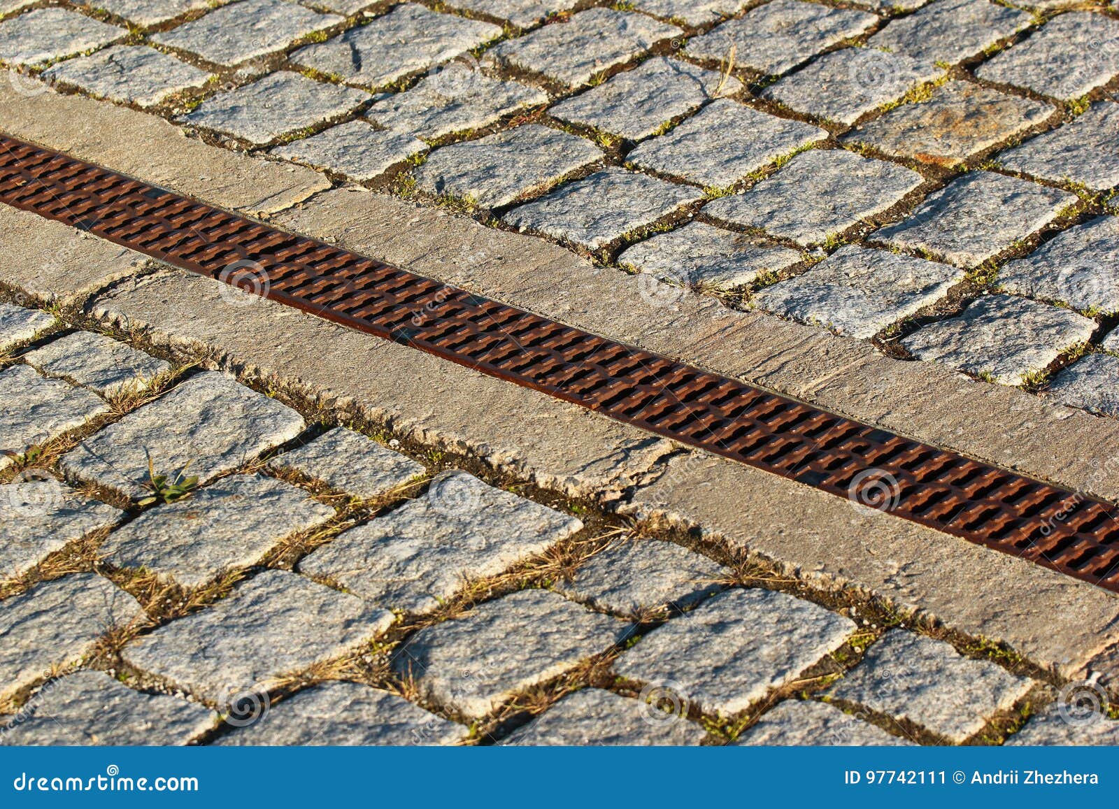 Rainwater Drainage Grid in a Cobbled Pavement Stock Image - Image of ...