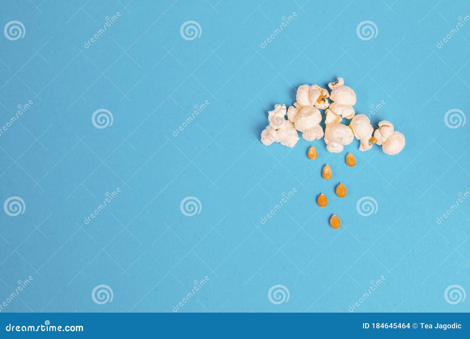 Rainy Cloud Made Out of Popcorn on a Blue Background Stock Photo ...