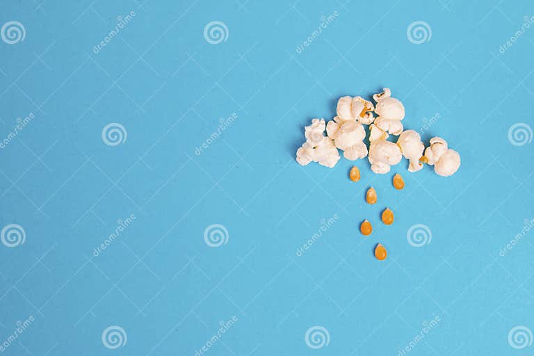 Rainy Cloud Made Out of Popcorn on a Blue Background Stock Photo ...