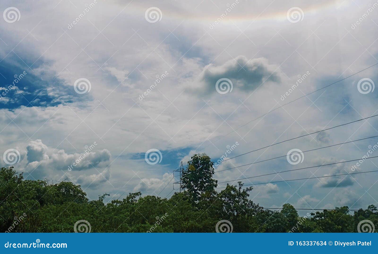 Rainy day and blue sky stock photo. Image of rainy, rainbow - 163337634