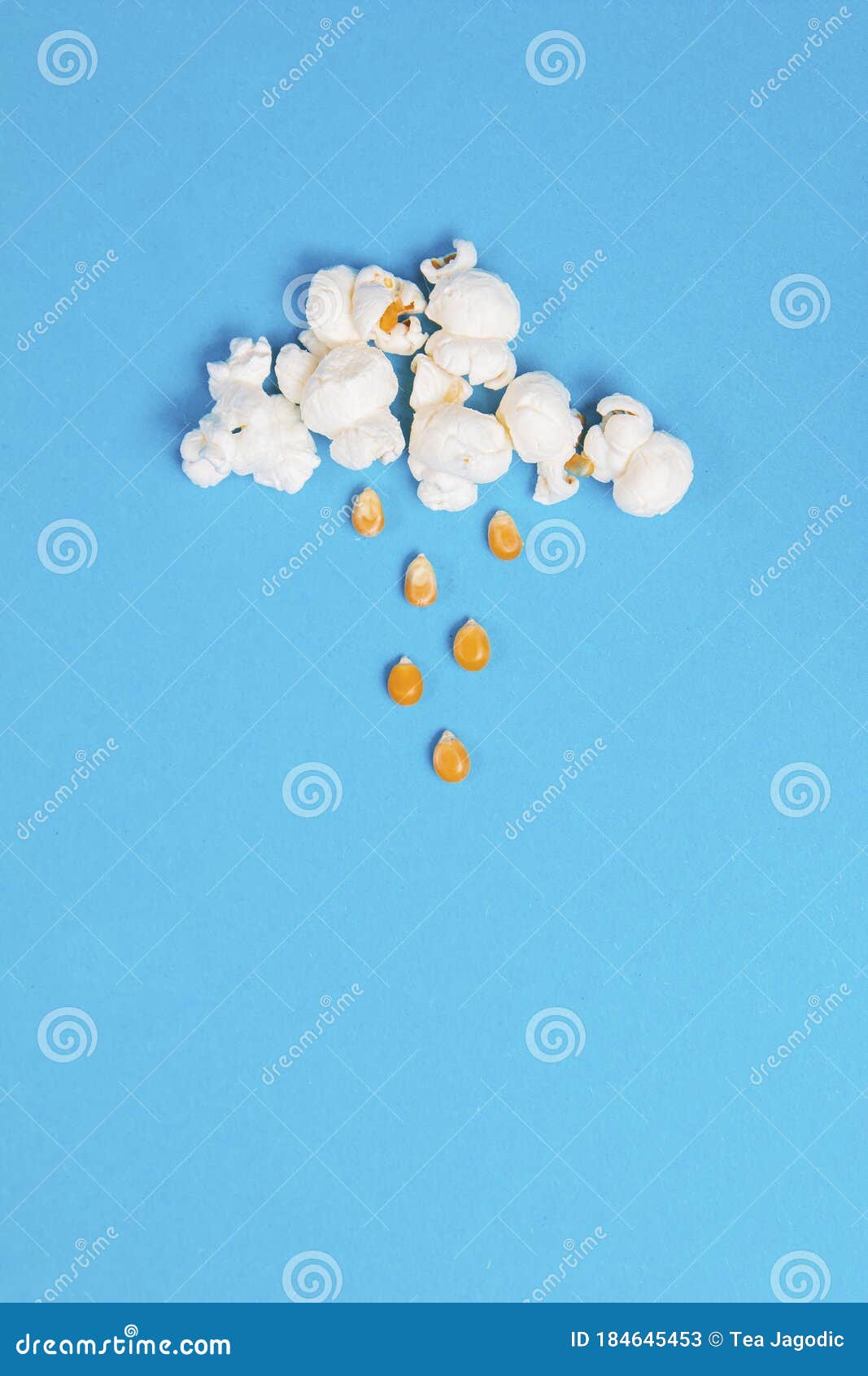 Rainy Cloud Made Out of Popcorn on a Blue Background Stock Image ...