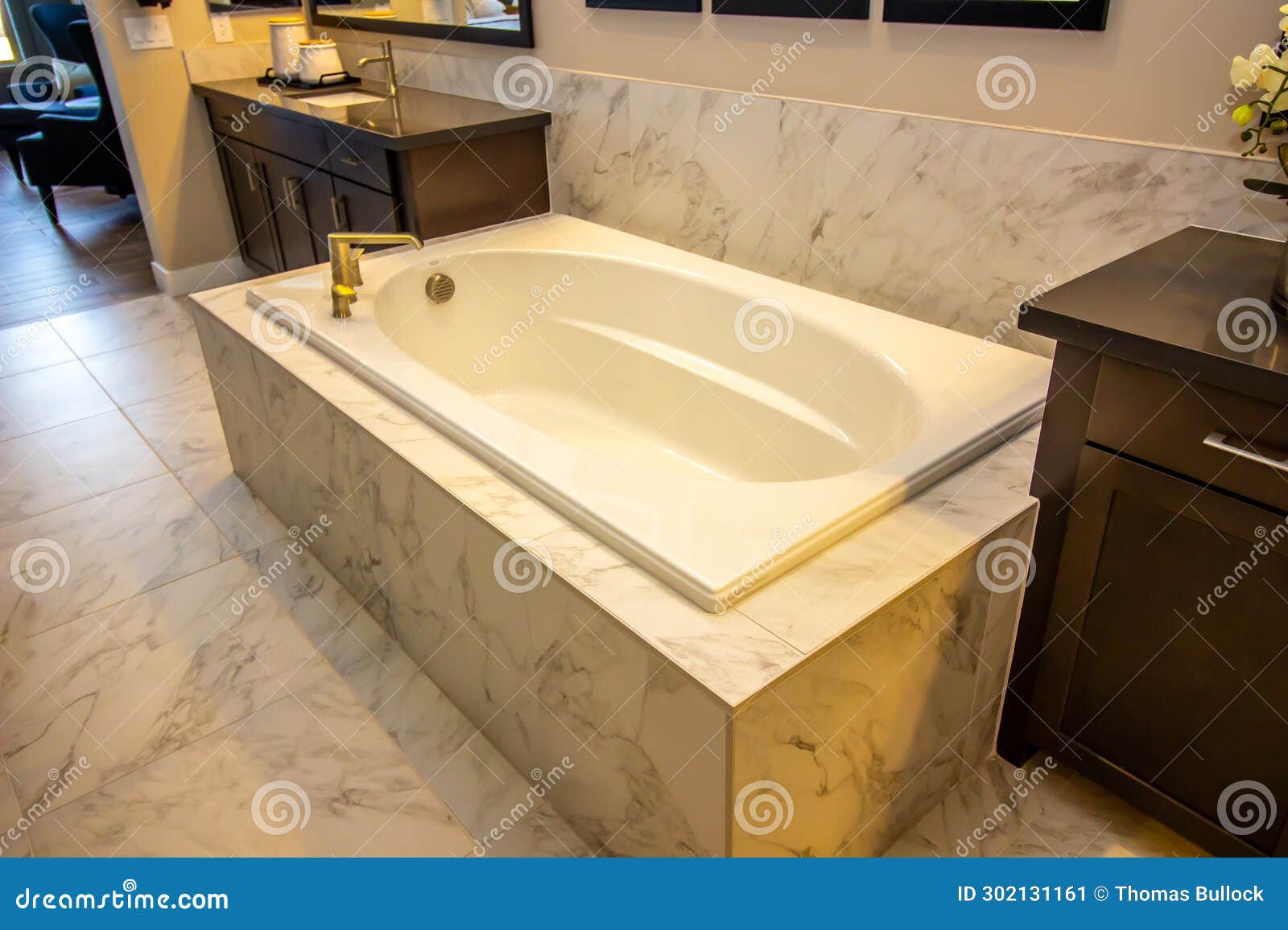 Raised Bathtub in Master Bathroom Stock Image - Image of drawers ...