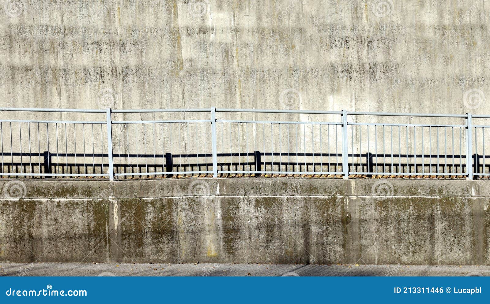 Raised Footpath Protected by a Metal Railing on a Grunge and Rough ...