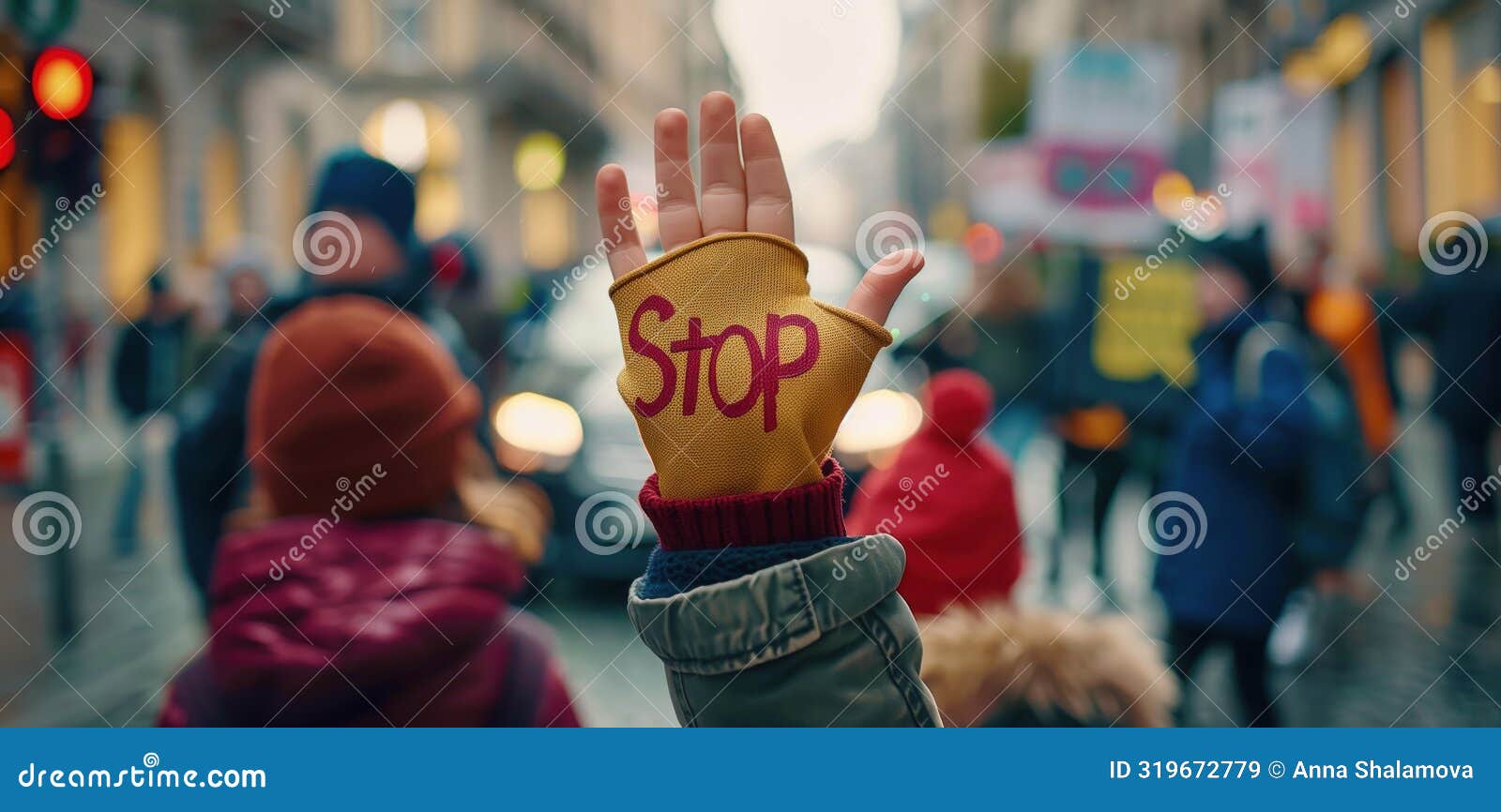 Raised Hand in a Yellow Glove with Stop Sign in a Protest Crowd. Stock ...