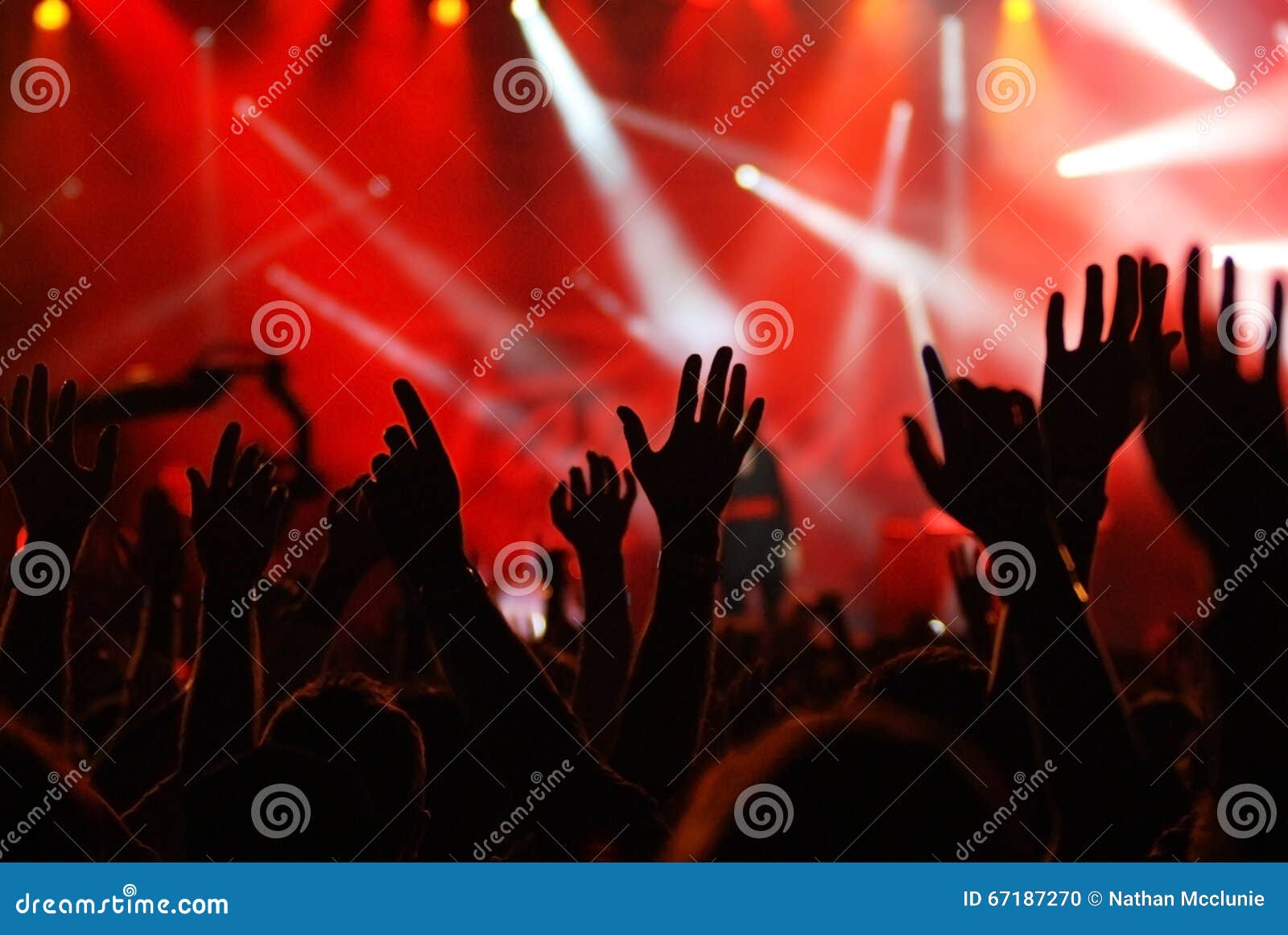 Raised hands at a concert stock photo. Image of lighting - 67187270