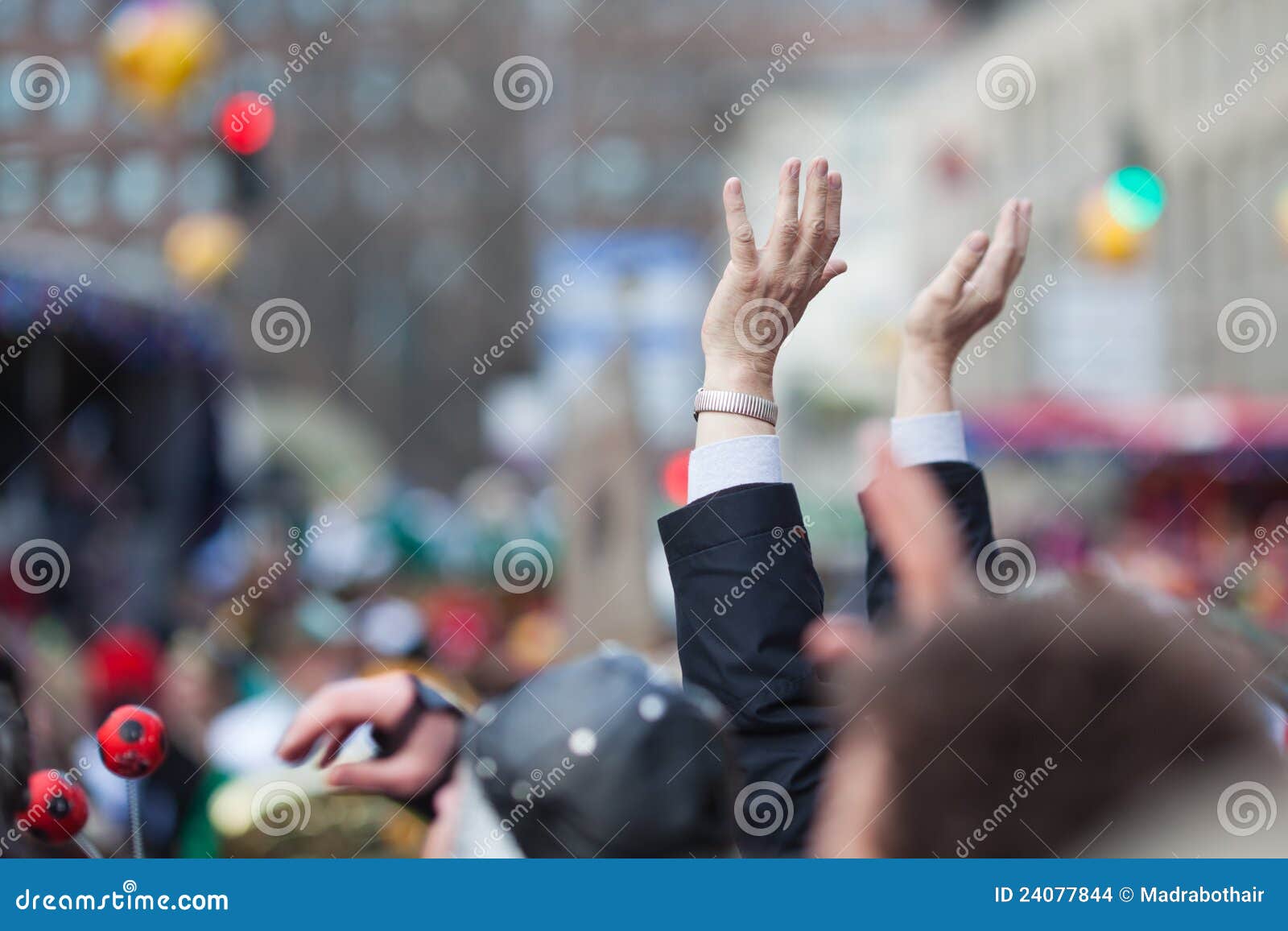 Raised hands in a crowd stock photo. Image of citylife - 24077844