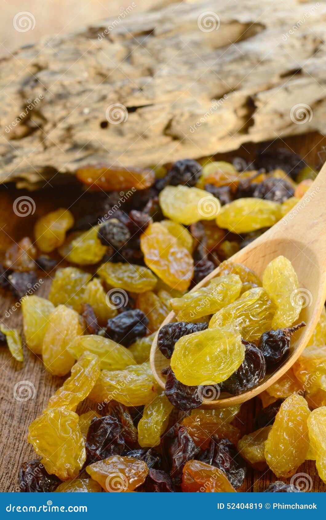 Raisins on wood table stock image. Image of nutrition - 52404819