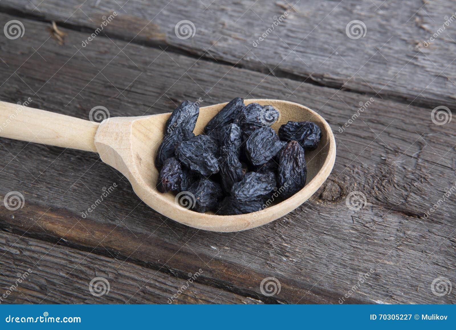 Raisins in wooden spoon stock image. Image of organic - 70305227