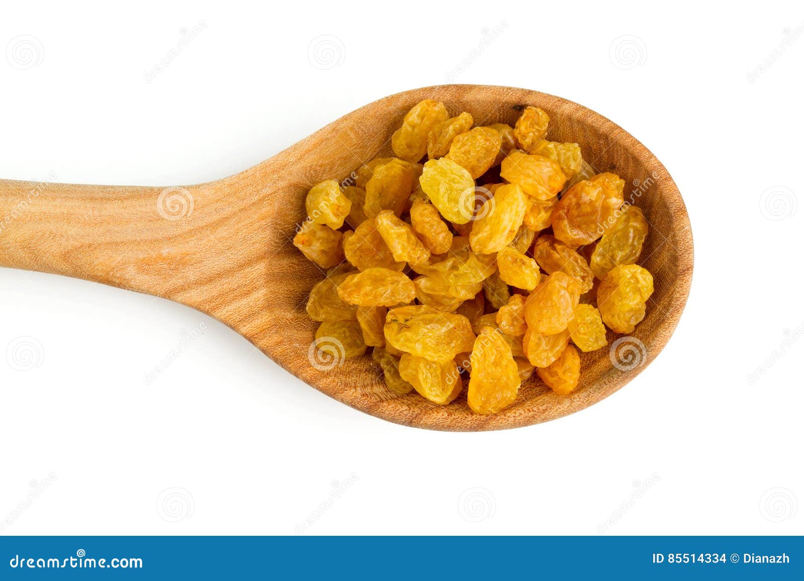 Raisins in a wooden spoon stock photo. Image of healthy - 85514334