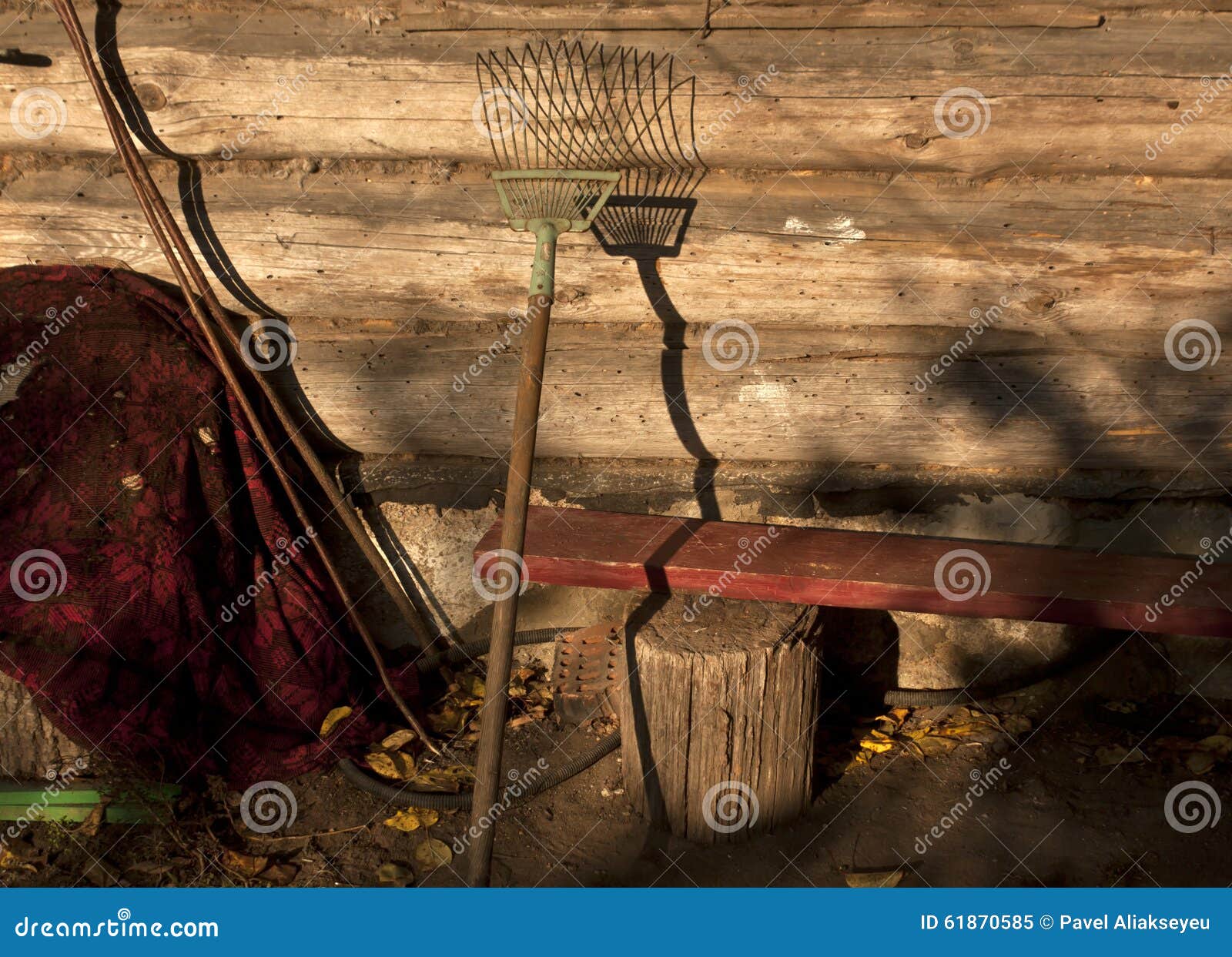 Rake and Its Shadow in Front of Old Wooden Barn. Stock Image - Image of ...