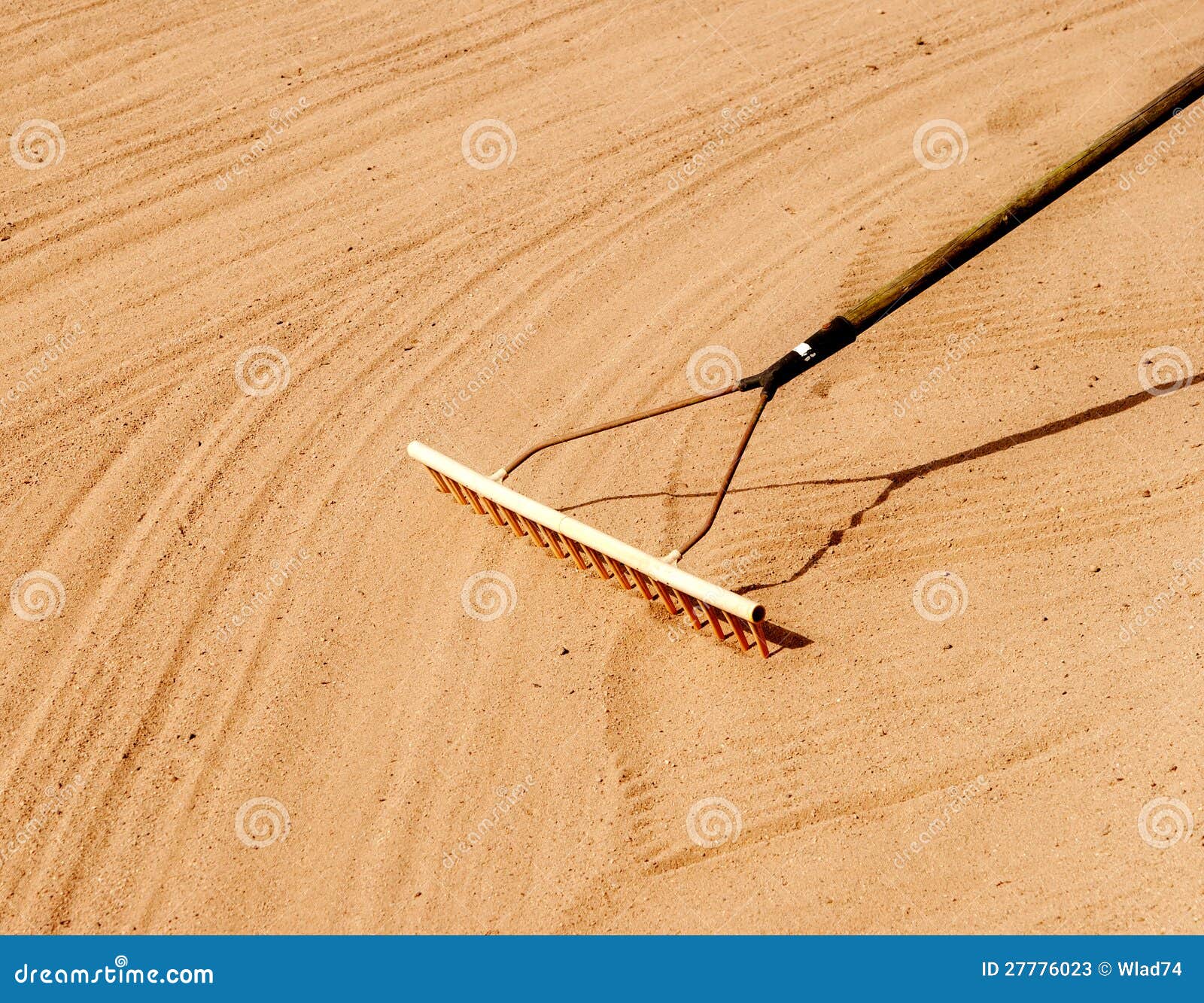 Rake on the sand stock image. Image of tool, sunlit, outside - 27776023