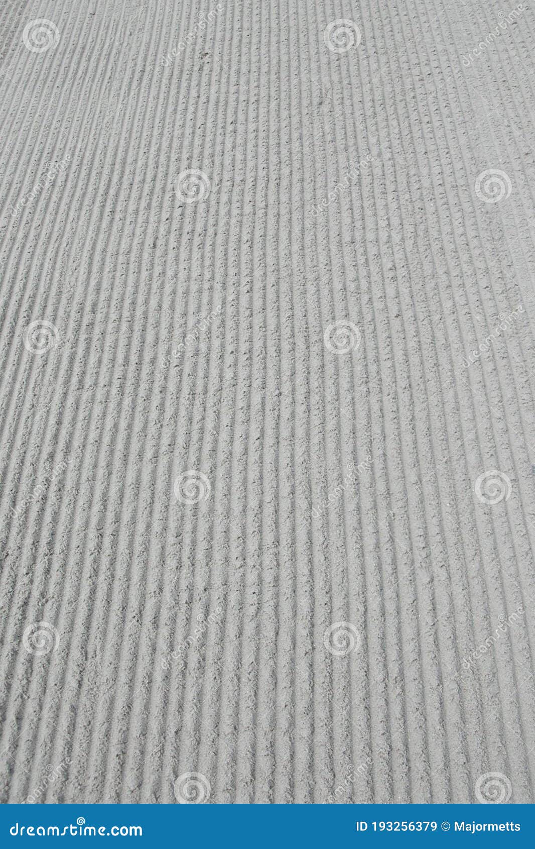 Raked beach sand, vertical stock image. Image of sand - 193256379