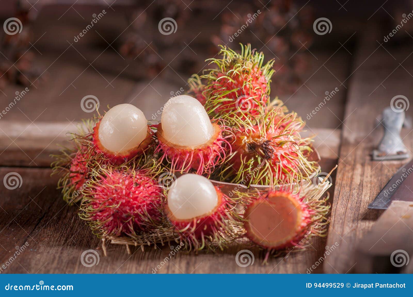 Rambutan on wood table stock image. Image of healthy - 94499529