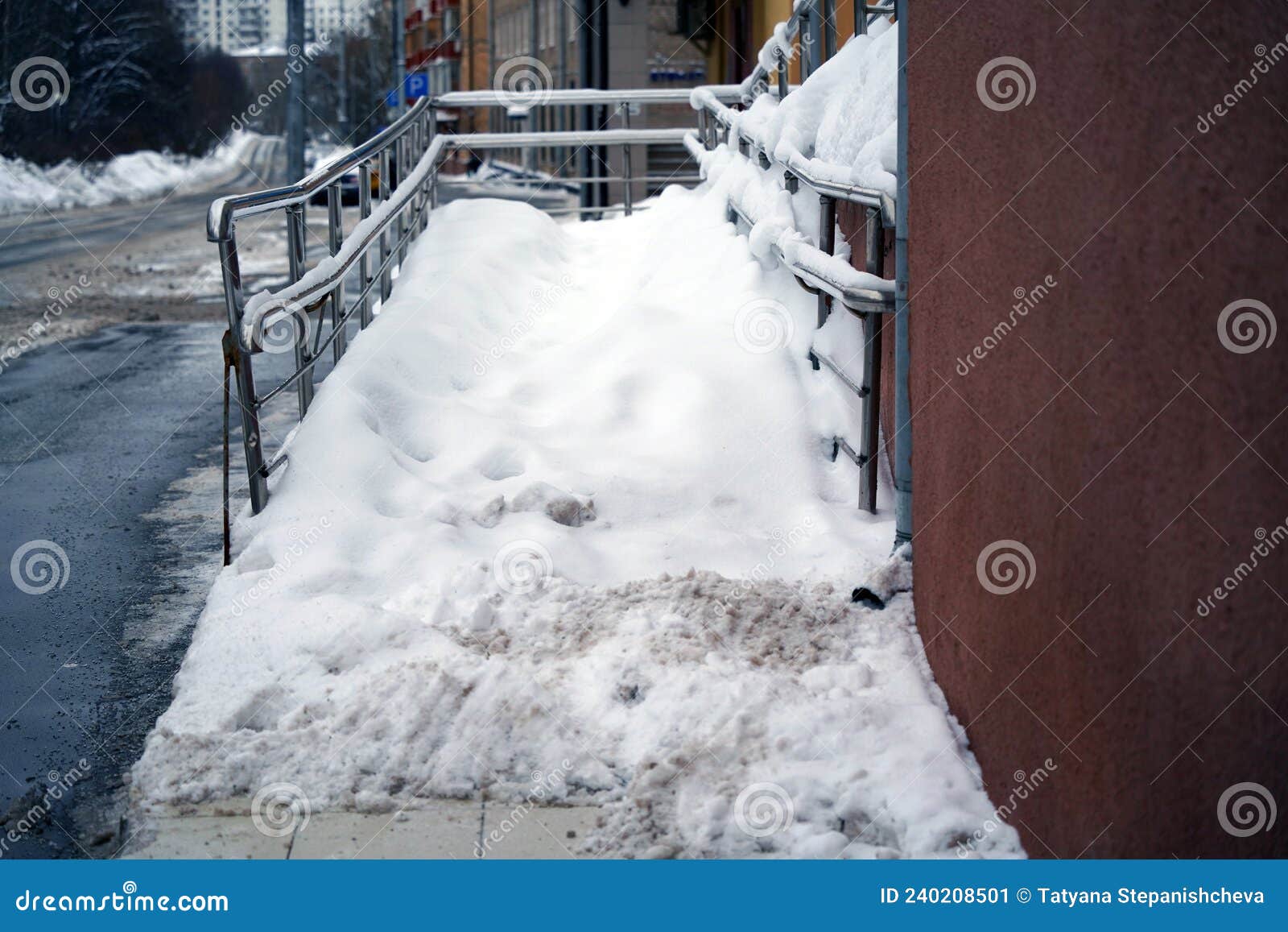 The Ramp for Visitors with Disabilities is Covered with Snow. Traces of ...