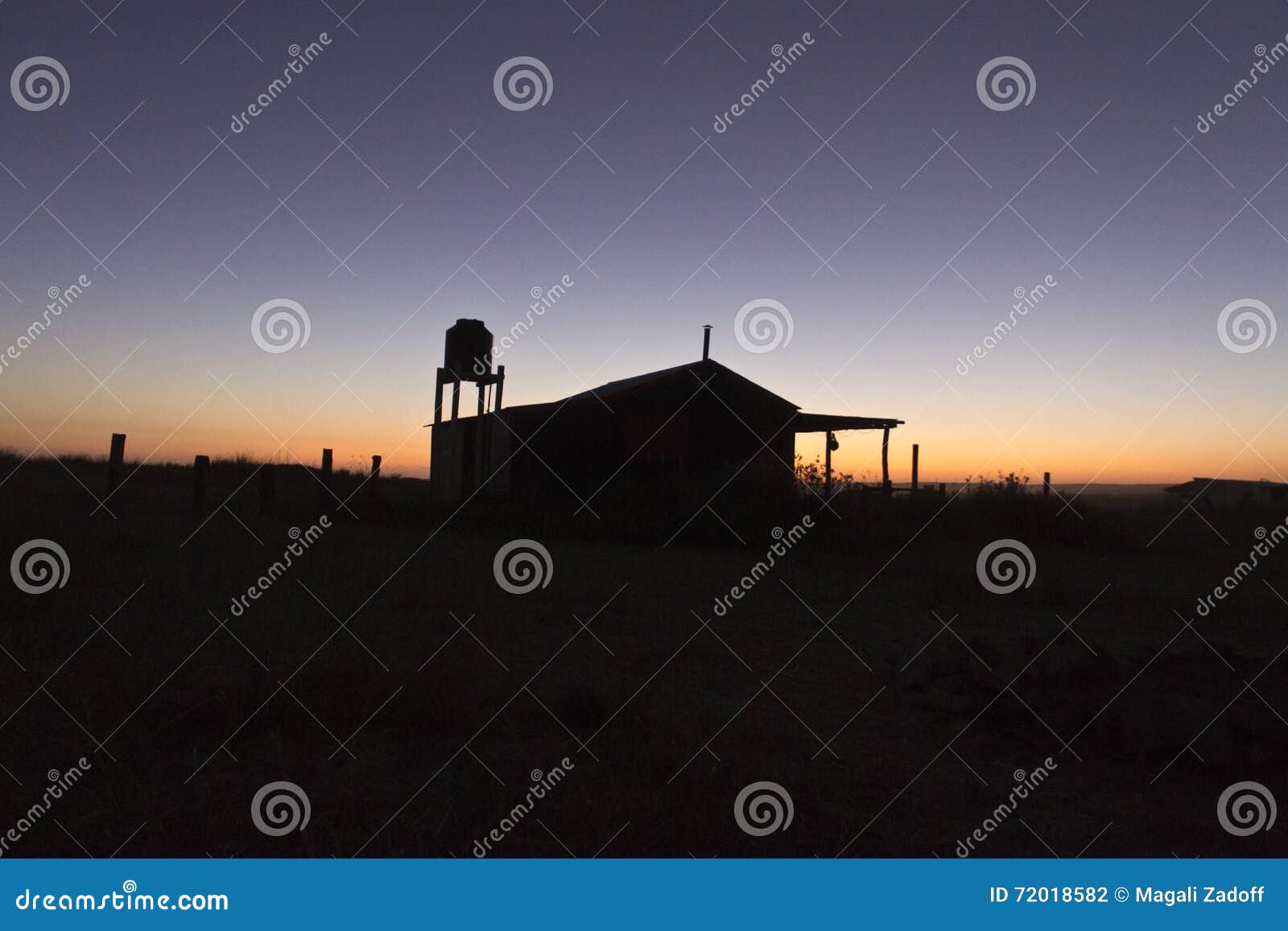 Ranch house at sunset stock photo. Image of tank, backlight - 72018582