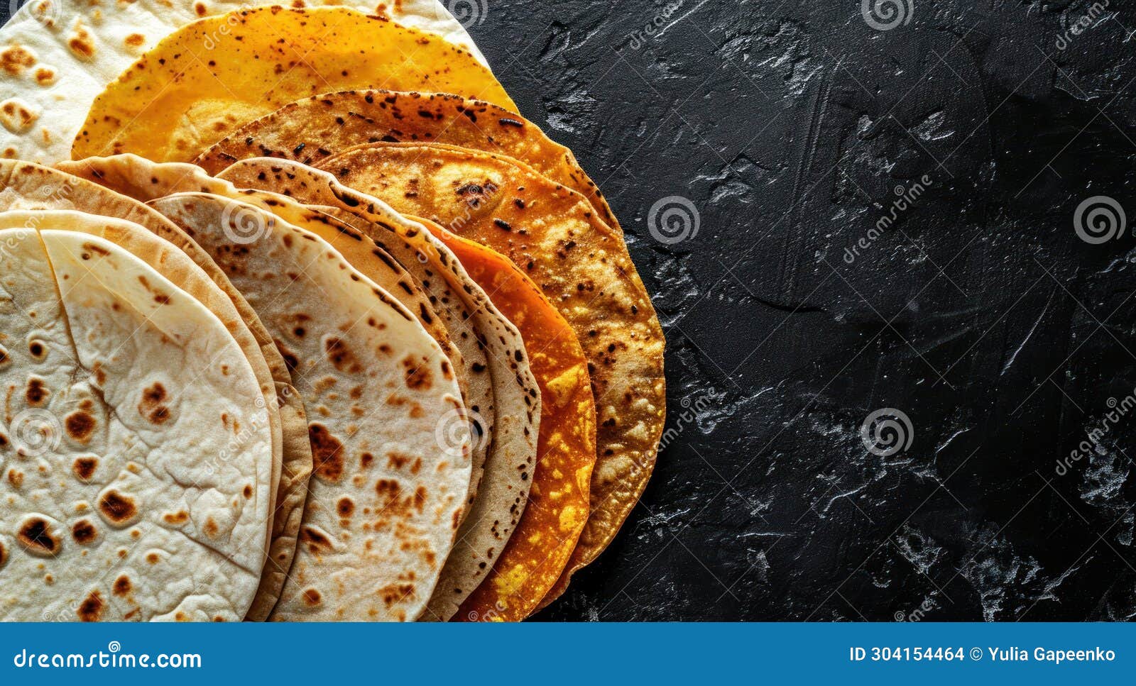 A Range of Different Types of Mexican Tortillas on a Table on Black ...
