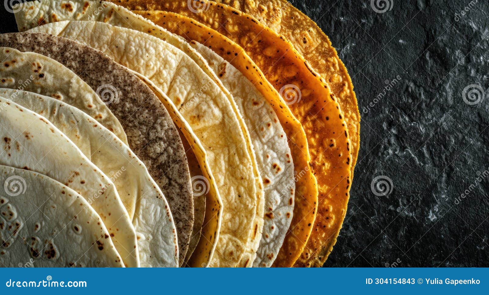 A Range of Different Types of Mexican Tortillas on a Table on Black ...