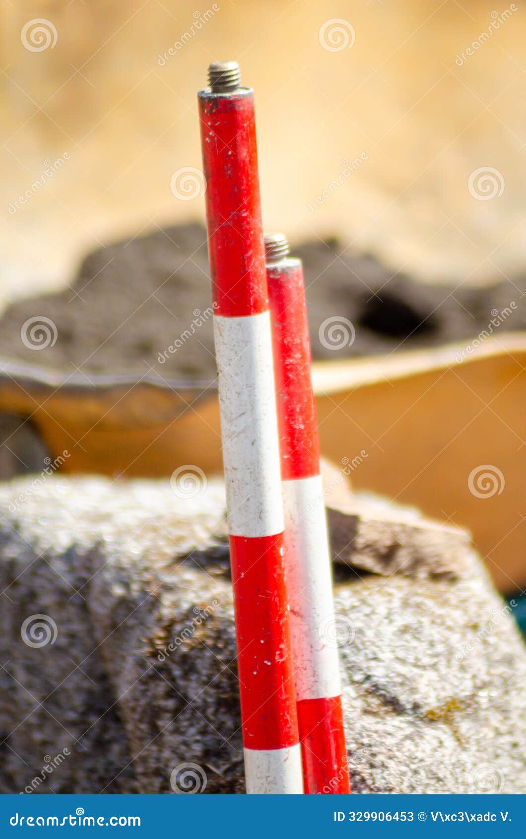 Range Poles in an Archeological Dig with a Wheelbarrow Full of Soil on ...