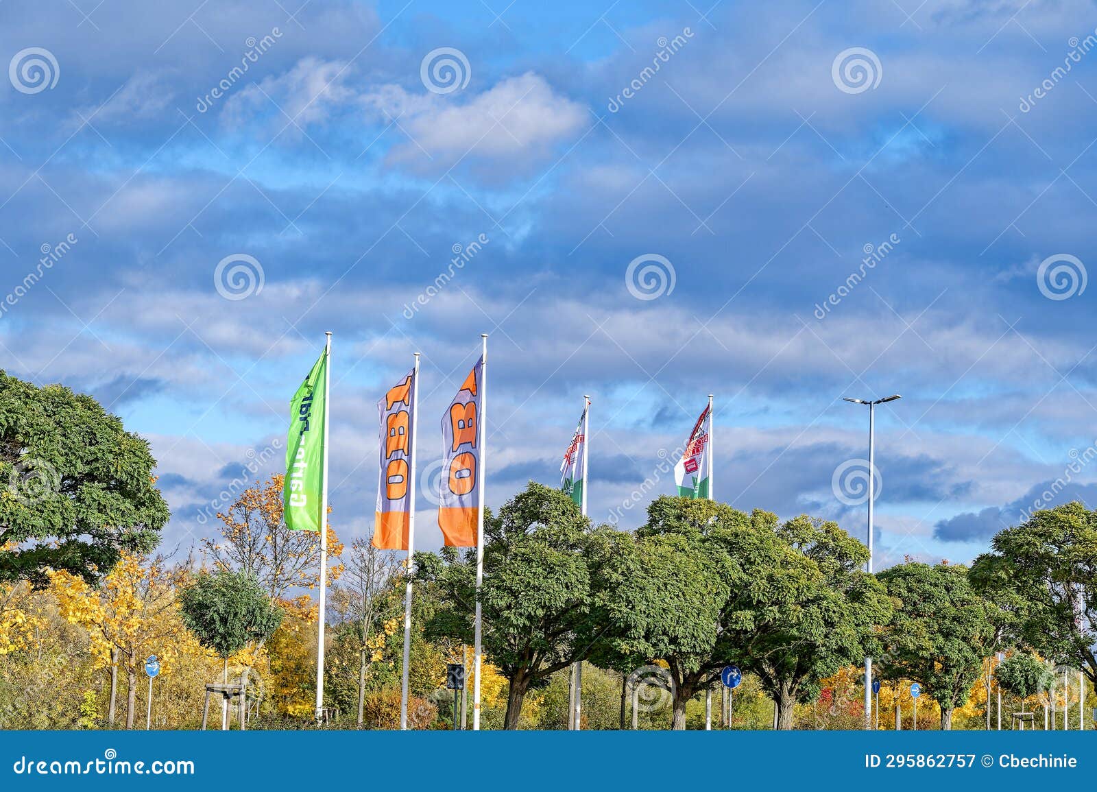 Flags of a Hardware Store in Germany in Front of a Blue Sky Editorial ...