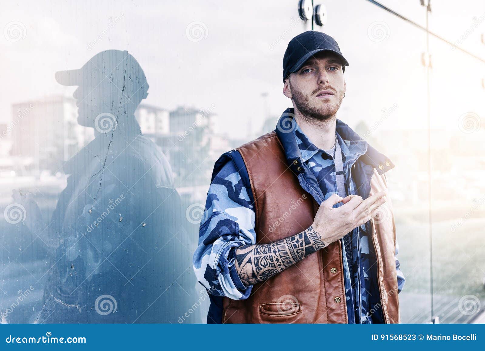 A Rap Singer is Reflected in a Blue Mirror Stock Image - Image of ...