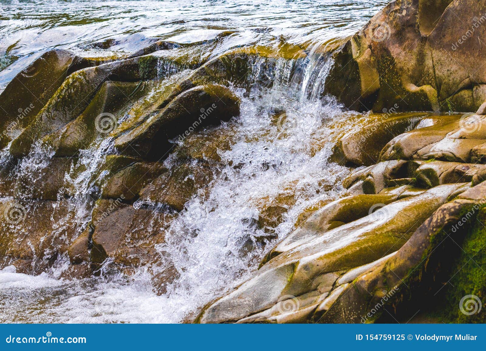 The Rapid Flow of Water among the Smooth Stones in the Mountain River ...