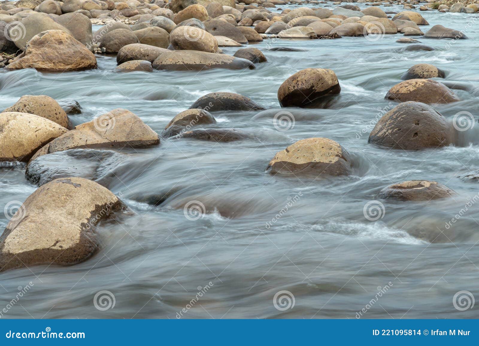 Rapid And Powerful Water Flow Between Large Rocks, Close-up. Boulders ...
