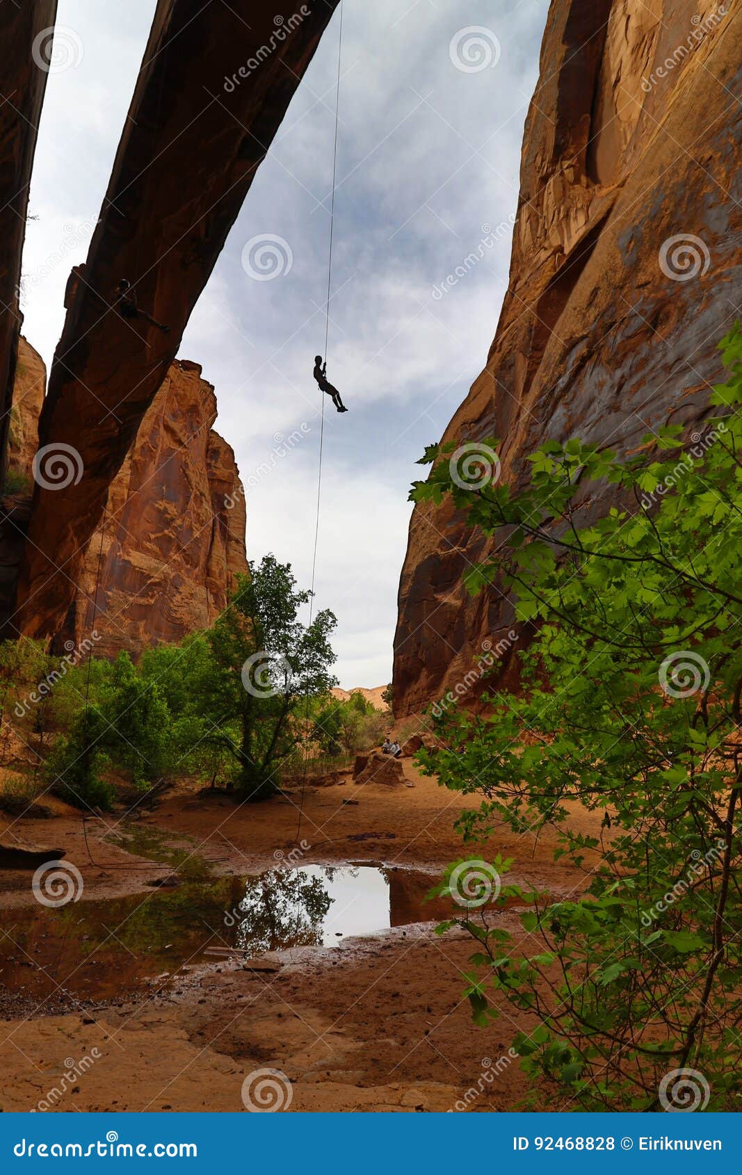 Rappeling of arch in moab stock photo. Image of black - 92468828
